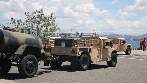 Parked Humvee jeep towing bowser | Stock Video | Pond5