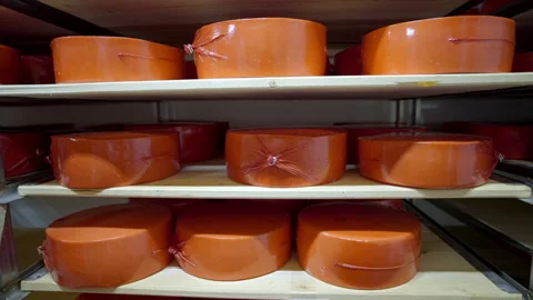 Parmesan wheel in red package ripening o... | Stock Video | Pond5