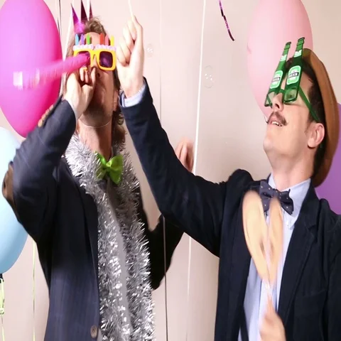 Party guys in photo booth | Stock Video | Pond5