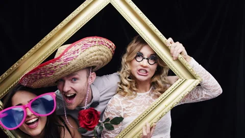 Party people, frame and pose with props ... | Stock Video | Pond5