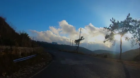 Passed along settlement and curvy roads ... | Stock Video | Pond5