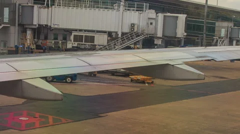 Passenger Loading Bridge behind Airliner... | Stock Video | Pond5