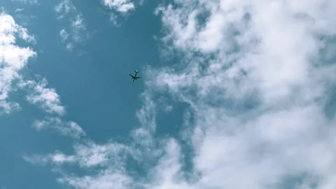 passenger plane flies high in the sky am... | Stock Video | Pond5