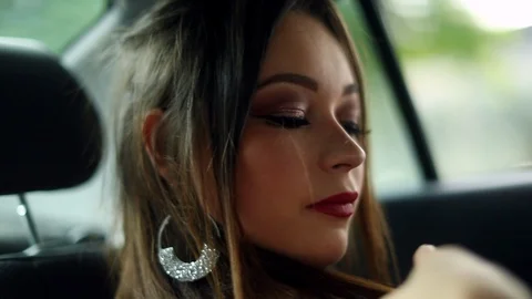 Passenger pretty girl in back-seat of ca... | Stock Video | Pond5