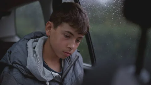 Passenger young boy inside car. Candid k... | Stock Video | Pond5