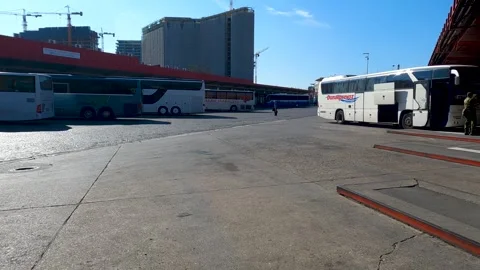Passengers boarding buses Bus terminal s... | Stock Video | Pond5