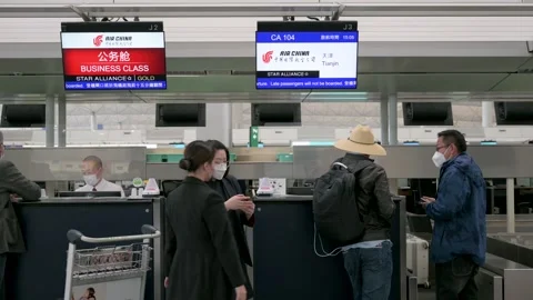Passengers check-in at the Air China air... | Stock Video | Pond5