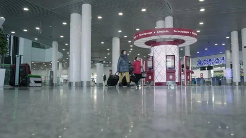 Passengers with luggage inside internati... | Stock Video | Pond5