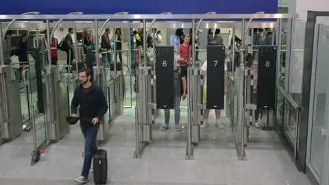 Passengers pass through automated passpo... | Stock Video | Pond5
