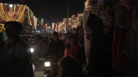 Passing people on Eid Milad un Nabi cele... | Stock Video | Pond5