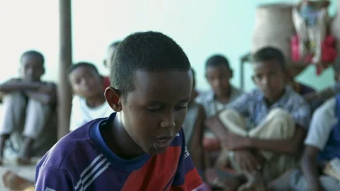 Passionate Learner: African Boy Immersed... | Stock Video | Pond5