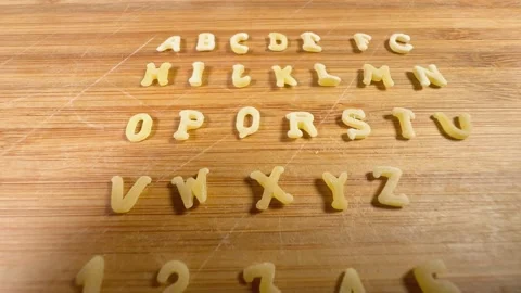 Pasta in alphabet letters and numerals s... | Stock Video | Pond5