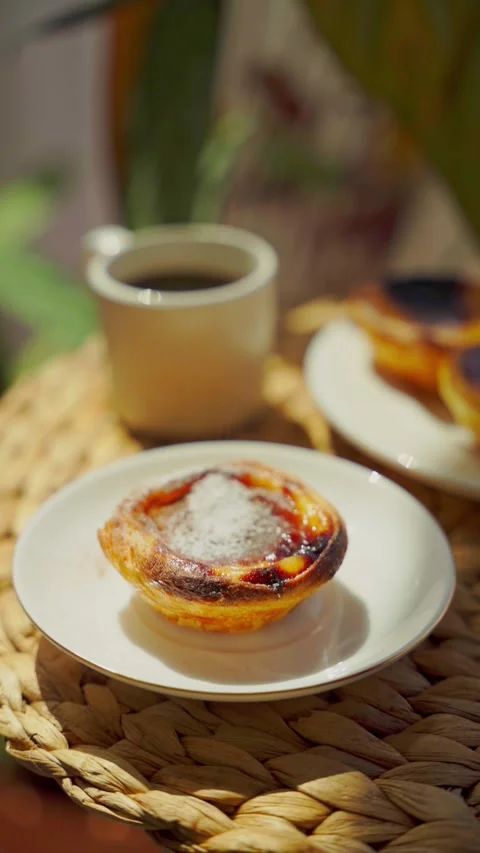 Pastel de nata and coffee on a round cof... | Stock Video | Pond5