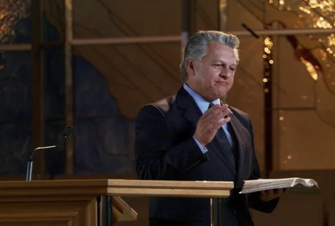 Pastor speaking from pulpit with stained... | Stock Video | Pond5