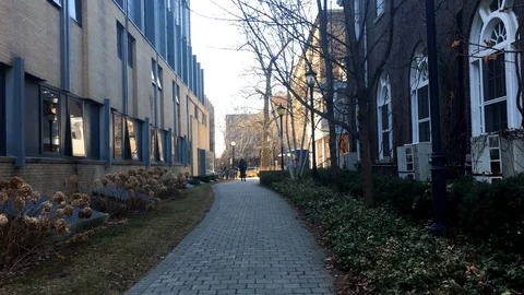 A pathway to walk between two buildings ... | Stock Video | Pond5