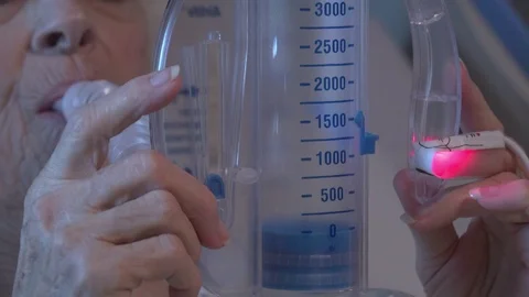 Patient using an incentive spirometer or... | Stock Video | Pond5