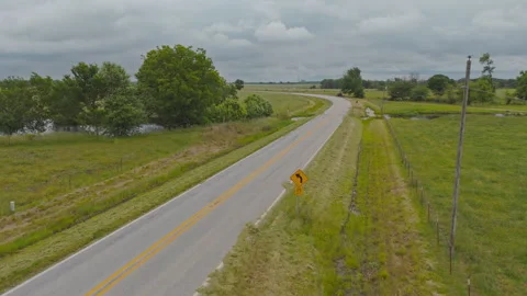Paved Road Through Open Rural Fields Nea... | Stock Video | Pond5