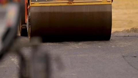 The paver mover on a flat newly made roa... | Stock Video | Pond5