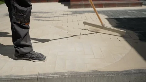 Paving slab laying and grouting. | Stock Video | Pond5