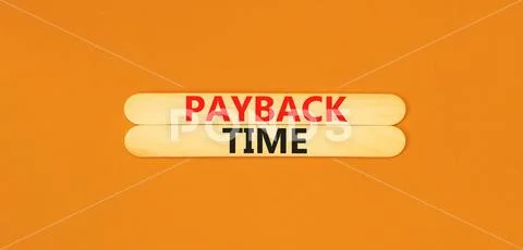 Payback time symbol. Concept words Payback time on wooden stick ...