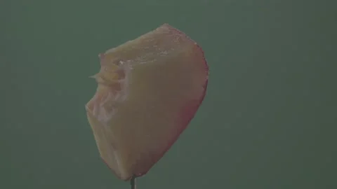 Peach rotating with loop on green screen... | Stock Video | Pond5