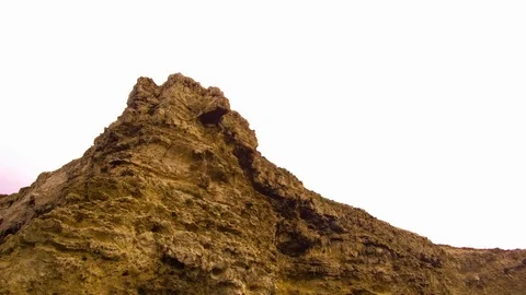 Peak of a tall coastal cliff seen from a... | Stock Video | Pond5