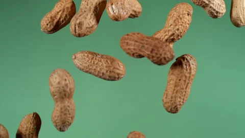 Peanuts in shell falling in slow motion,... | Stock Video | Pond5