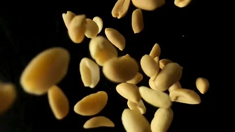 Peanuts slow motion shot black backgroun... | Stock Video | Pond5