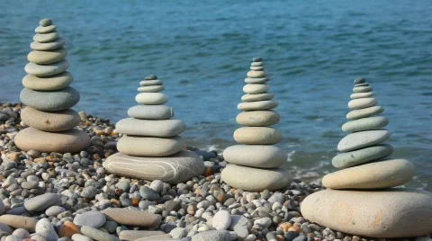 pebble stack on the stone seacoast, sea ... | Stock Video | Pond5