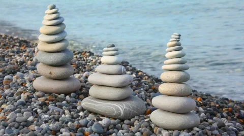 pebble stack on the stone seashore, sea ... | Stock Video | Pond5