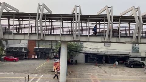 A pedestrian bridge from the LRT station... | Stock Video | Pond5