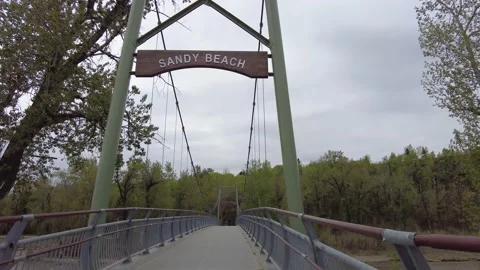 Pedestrian bridge at Sandy Beach Park ov... | Stock Video | Pond5