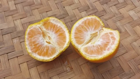 peeled or split citrus fruit and placed ... | Stock Video | Pond5