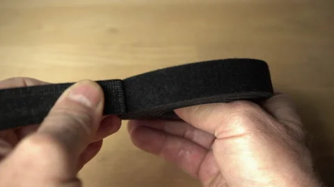Peeling Velcro fastener from a roll | Stock Video | Pond5