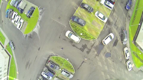 People and car moving on parking lot bet... | Stock Video | Pond5