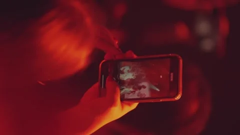 People in the auditorium are shooting on... | Stock Video | Pond5