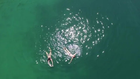 People bathe in the sea. Top view, aeria... | Stock Video | Pond5
