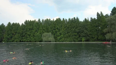 People bathing outdoor in the rain in sp... | Stock Video | Pond5