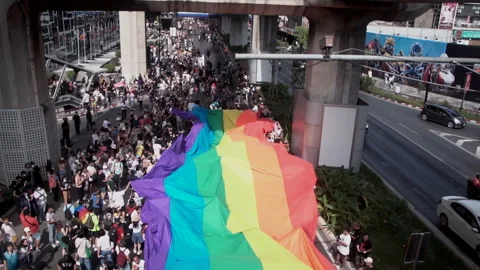 People carry a flag in a parade to kick ... | Stock Video | Pond5
