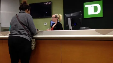 People at counter talking to the teller | Stock Video | Pond5