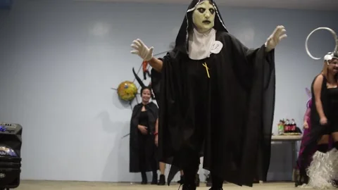 People dressed scary costumes join a fri... | Stock Video | Pond5