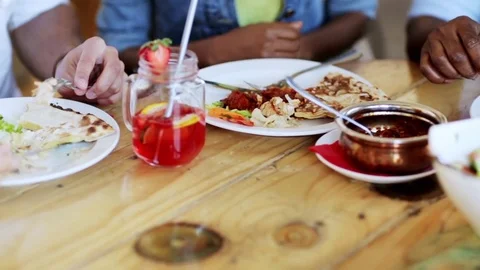 people eating food at restaurant table | Stock Video | Pond5