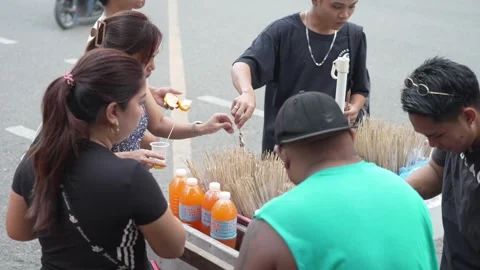 People eating street food known as 'Saan... | Stock Video | Pond5