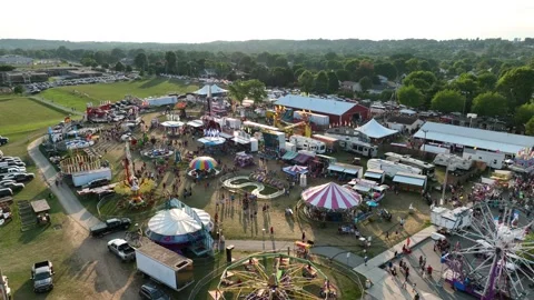 People enjoy outside fair. Carnival game... | Stock Video | Pond5
