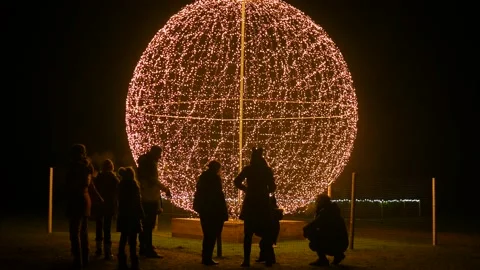 People in front of big light sphere that... | Stock Video | Pond5