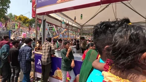 People have gathered on the stall to eat... | Stock Video | Pond5
