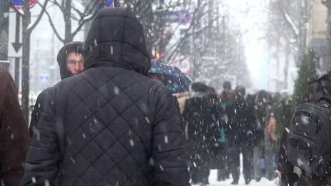 People in heavy snow blizzard fall in wi... | Stock Video | Pond5