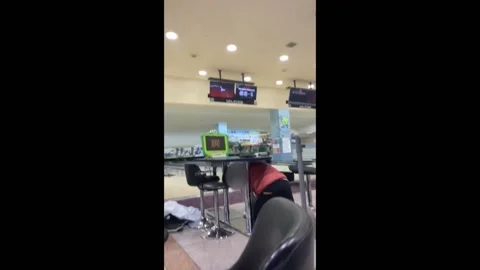 People Hide Under Tables At Bowling Alle... | Stock Video | Pond5