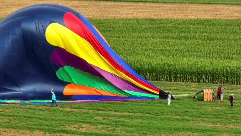 People Inflating a Colorful Hot Air Ball... | Stock Video | Pond5