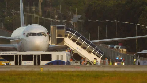 People leaving the plane, evacuation | Stock Video | Pond5